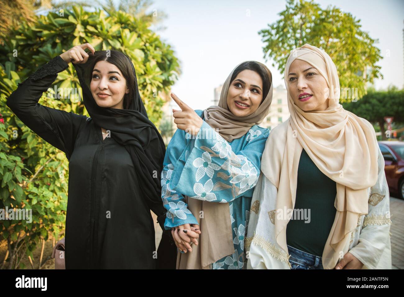 Arabic women with abaya bonding and having fun outdoors - Happy ...