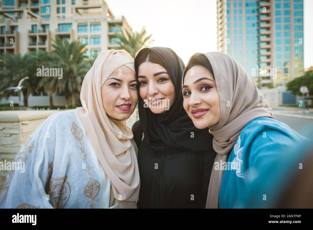 Arabic women with abaya bonding and having fun outdoors - Happy ...
