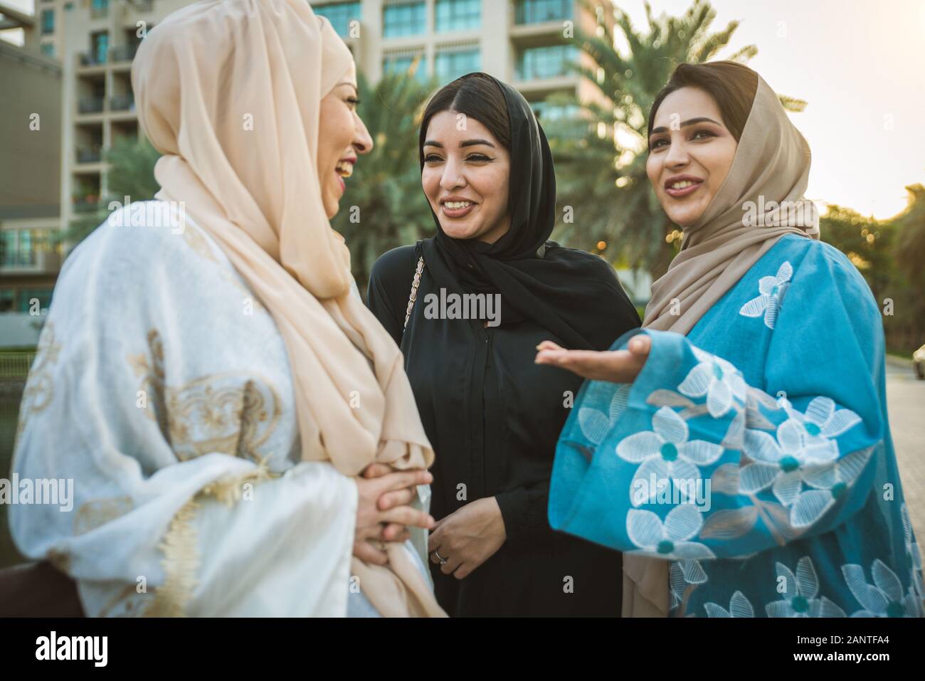 Arabic women with abaya bonding and having fun outdoors - Happy ...