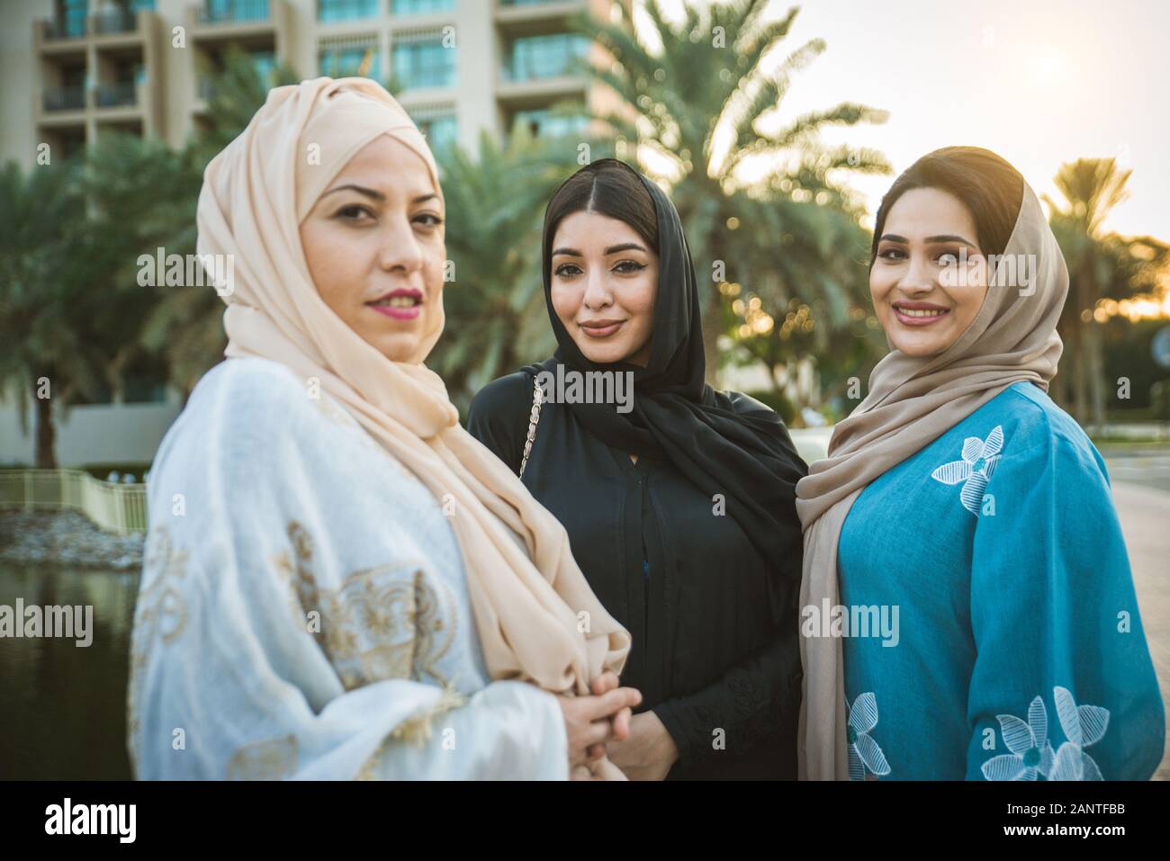 Arabic women with abaya bonding and having fun outdoors - Happy ...