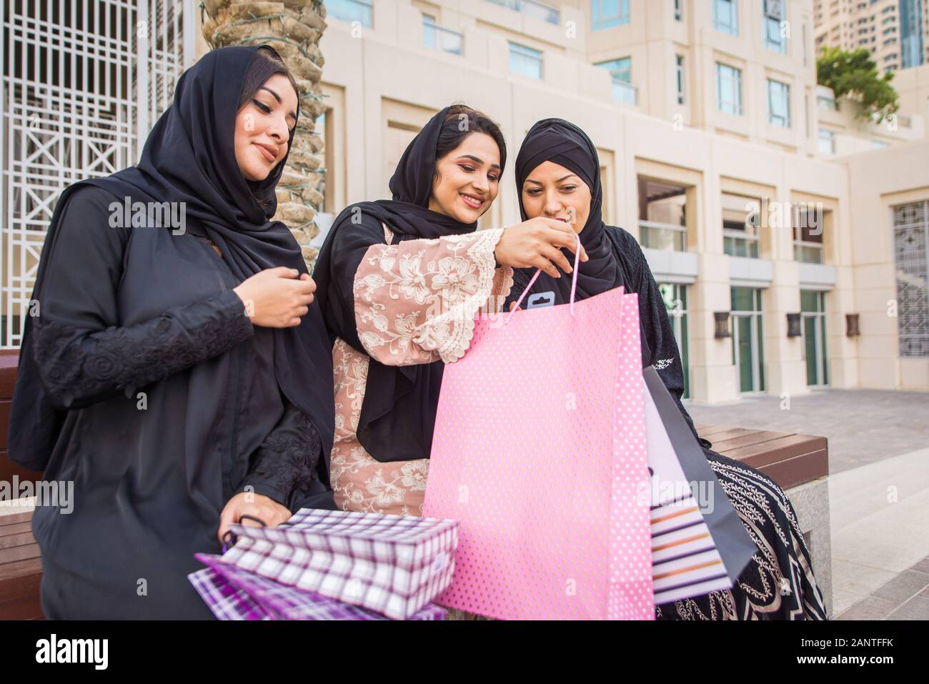 Arabic women with abaya bonding and having fun outdoors - Happy ...