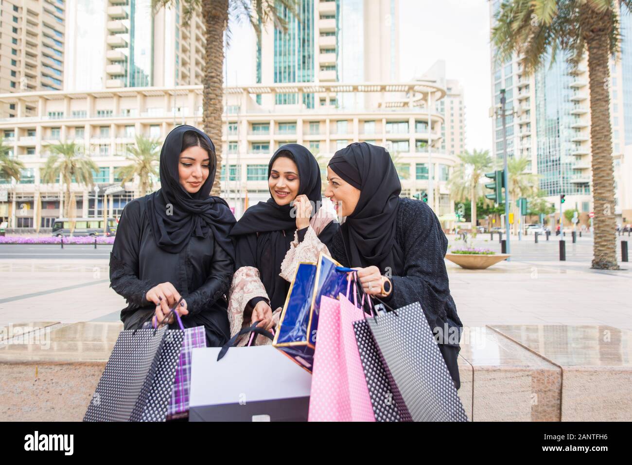 Arabic women with abaya bonding and having fun outdoors - Happy ...