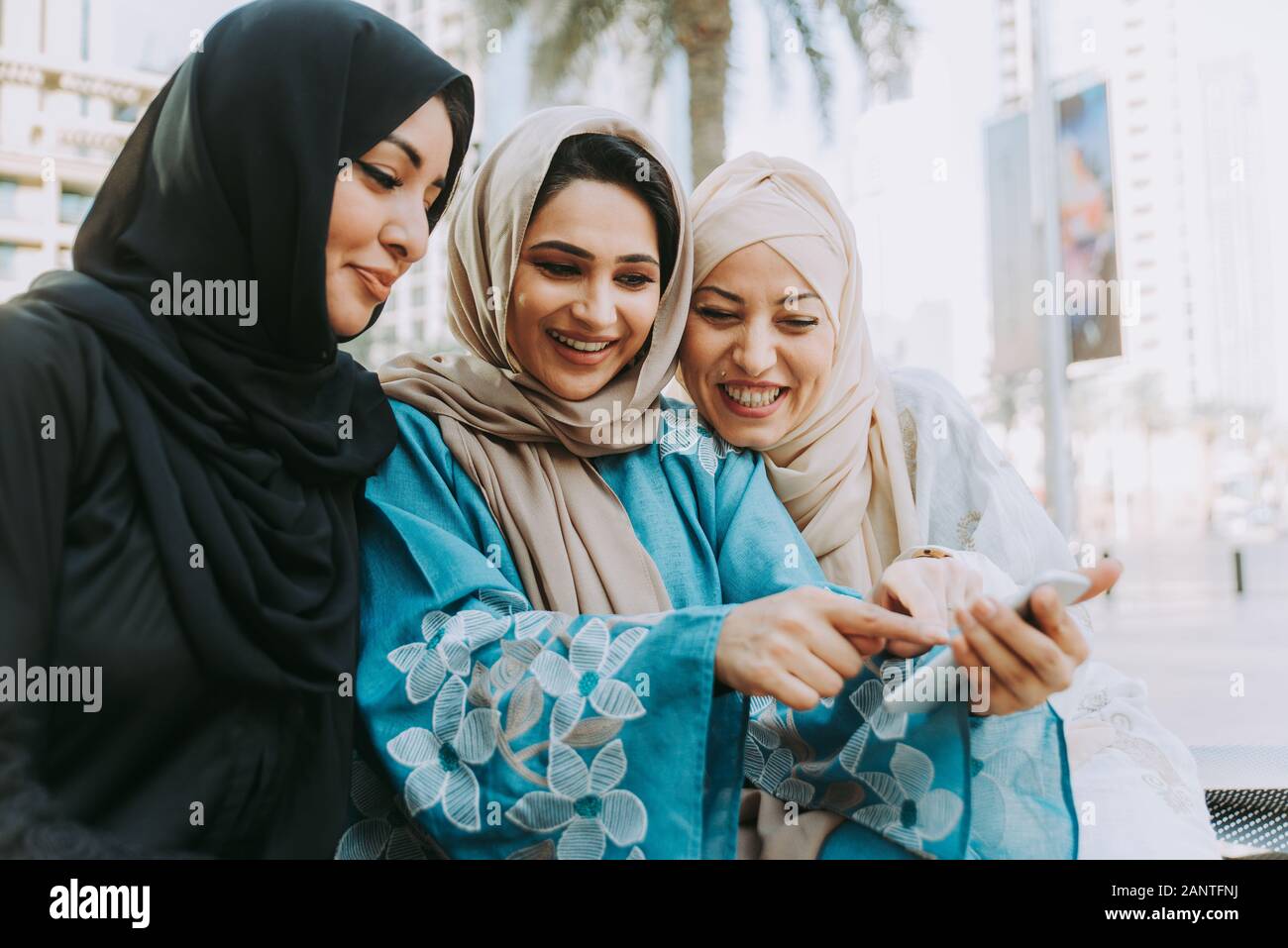 Arabic women with abaya bonding and having fun outdoors - Happy ...