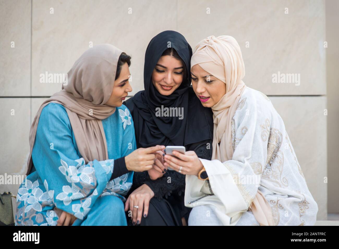 Arabic women with abaya bonding and having fun outdoors - Happy ...