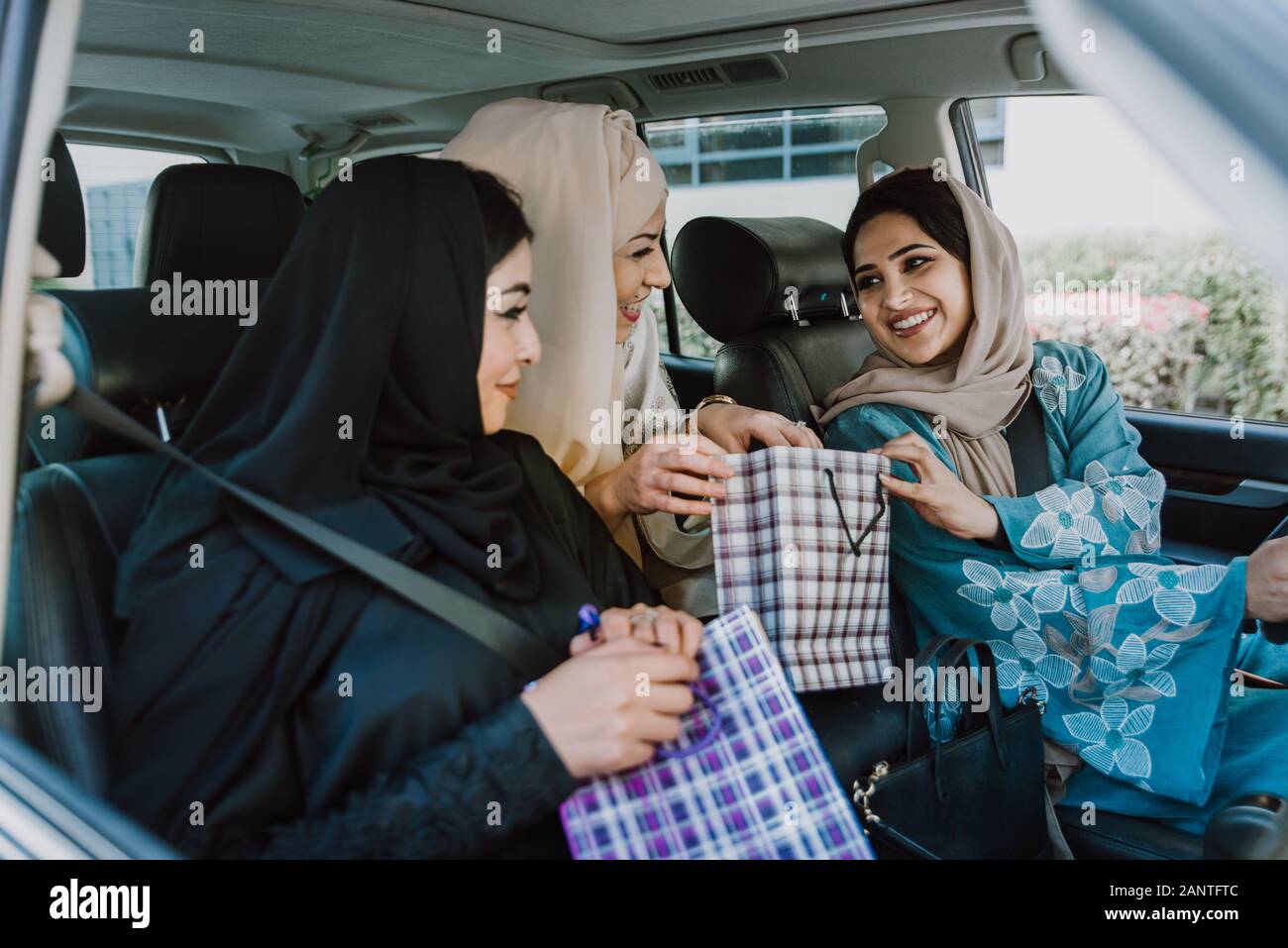 Arabic women with abaya bonding and having fun outdoors - Happy ...