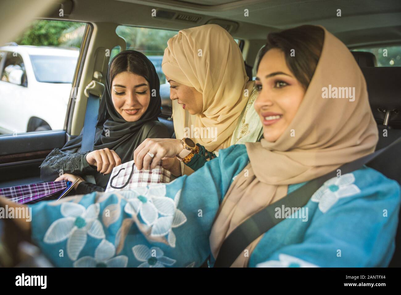 Arabic women with abaya bonding and having fun outdoors - Happy ...