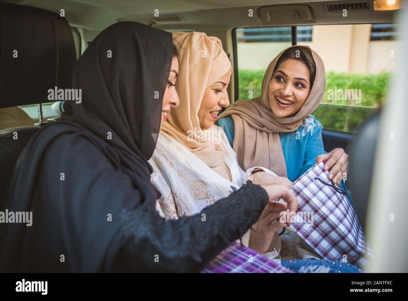 Arabic women with abaya bonding and having fun outdoors - Happy ...