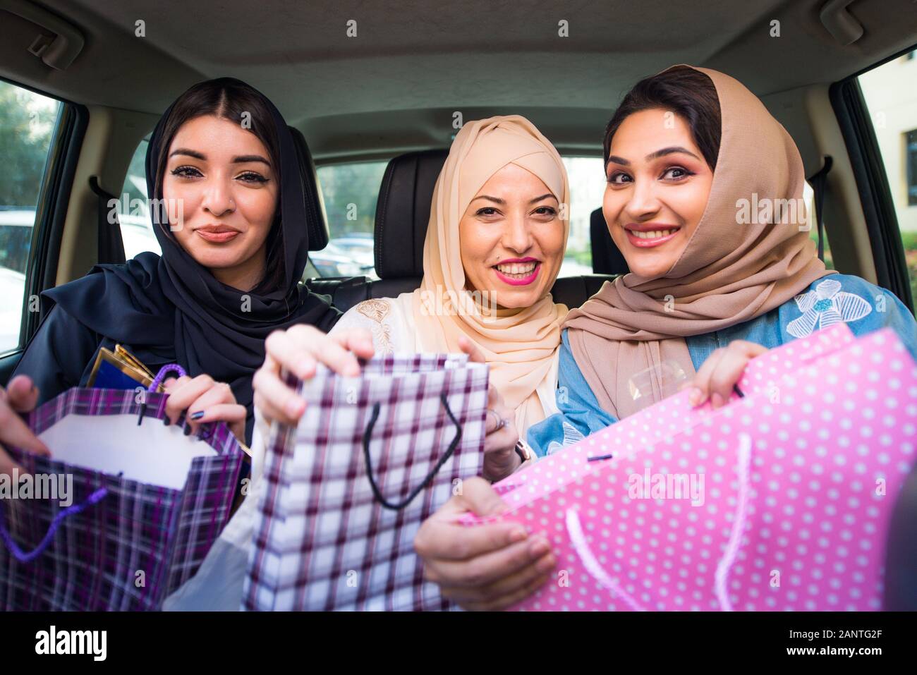 Arabic women with abaya bonding and having fun outdoors - Happy ...