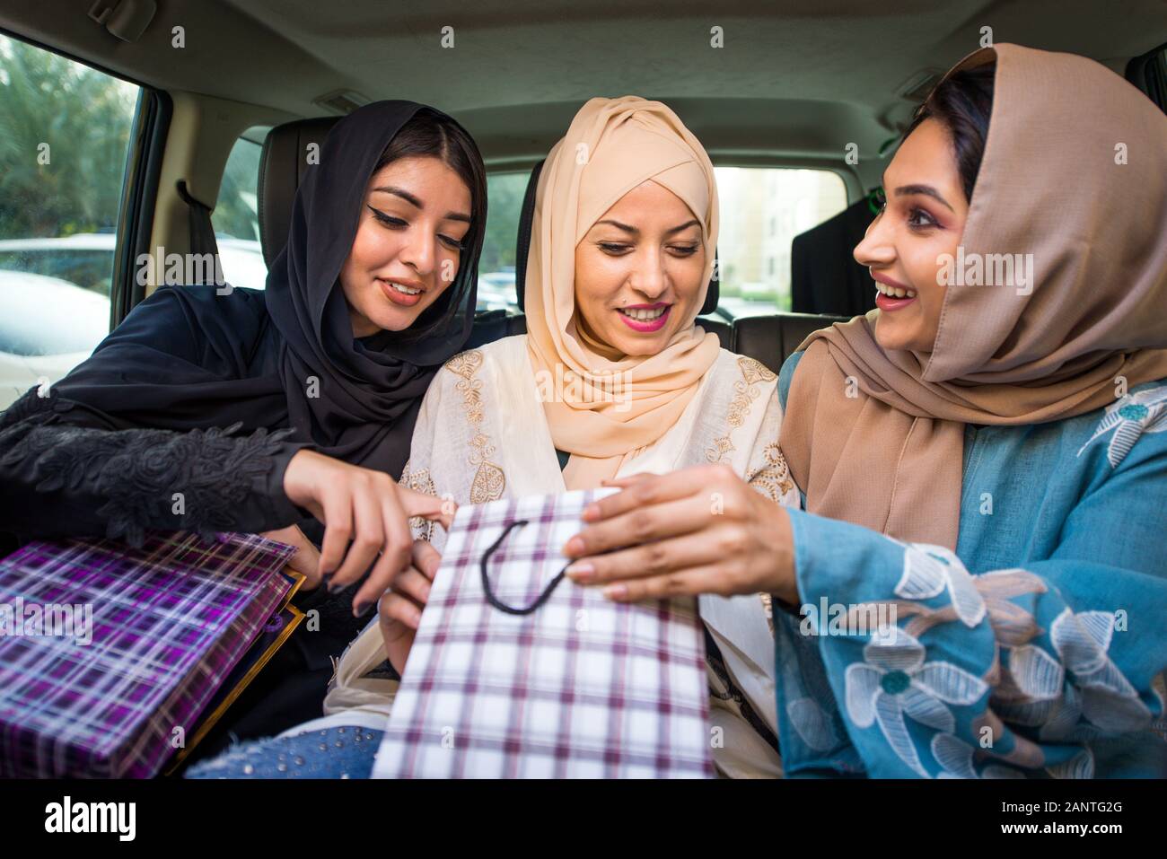 Arabic women with abaya bonding and having fun outdoors - Happy ...