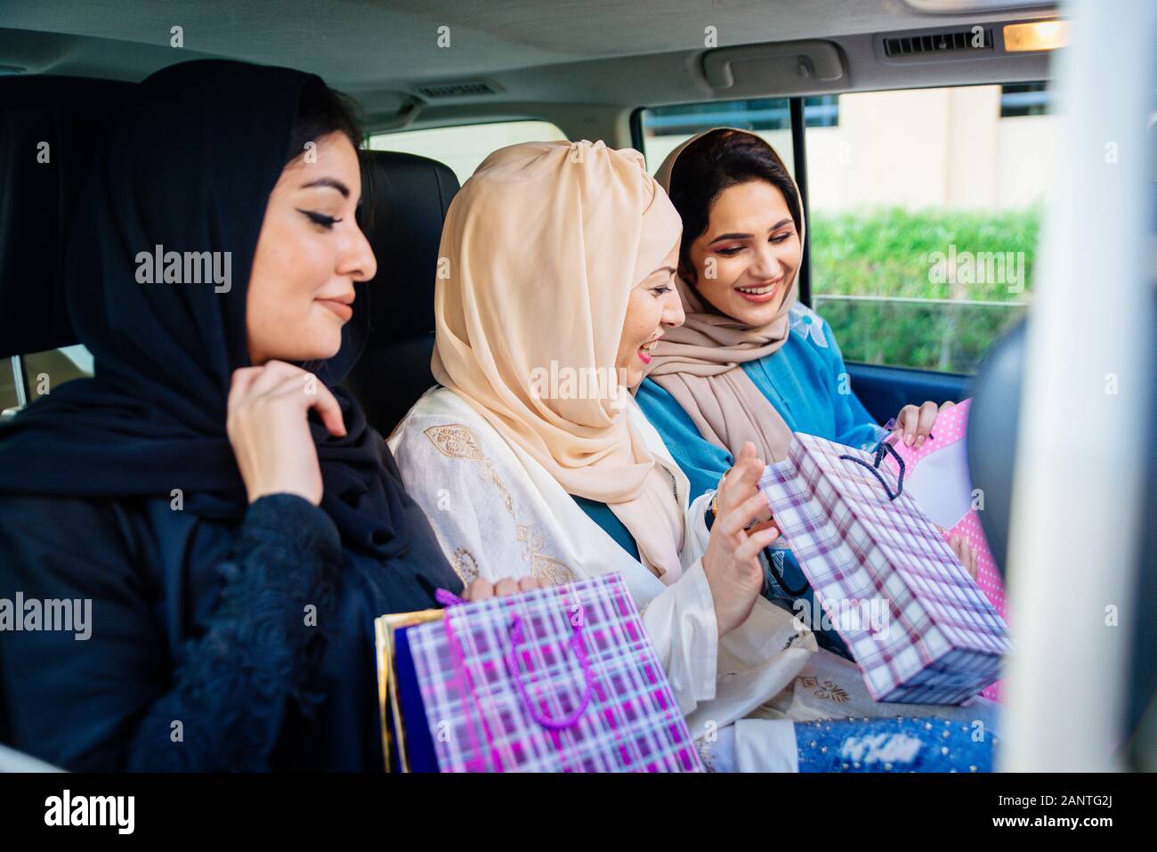 Arabic women with abaya bonding and having fun outdoors - Happy ...