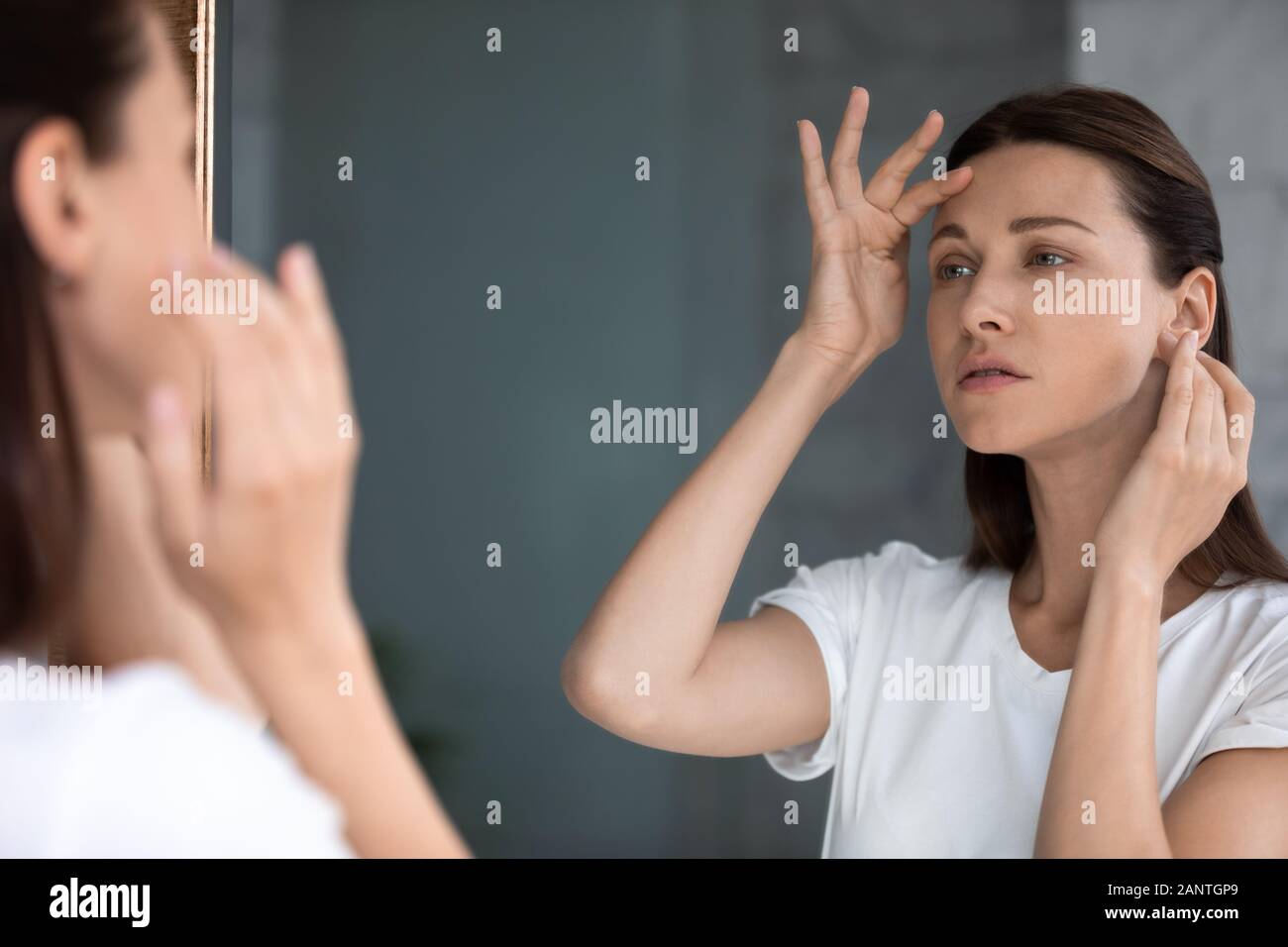 Woman face mimic mirror hi-res stock photography and images - Alamy