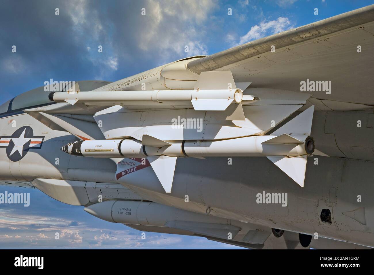 Missiles under the wing of a fighter plane against blue sky Stock Photo ...