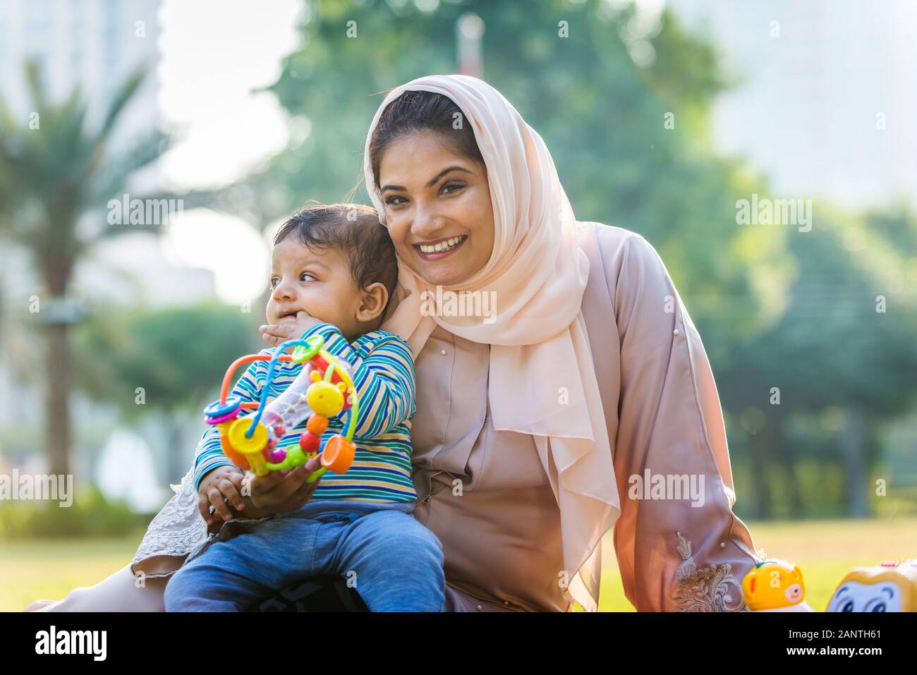 Middle eastern family with traditional dress having fun outdoors ...