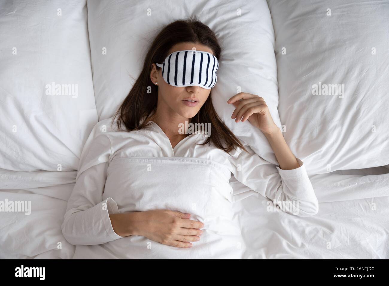 Woman wearing in bed hi-res stock photography and images - Alamy
