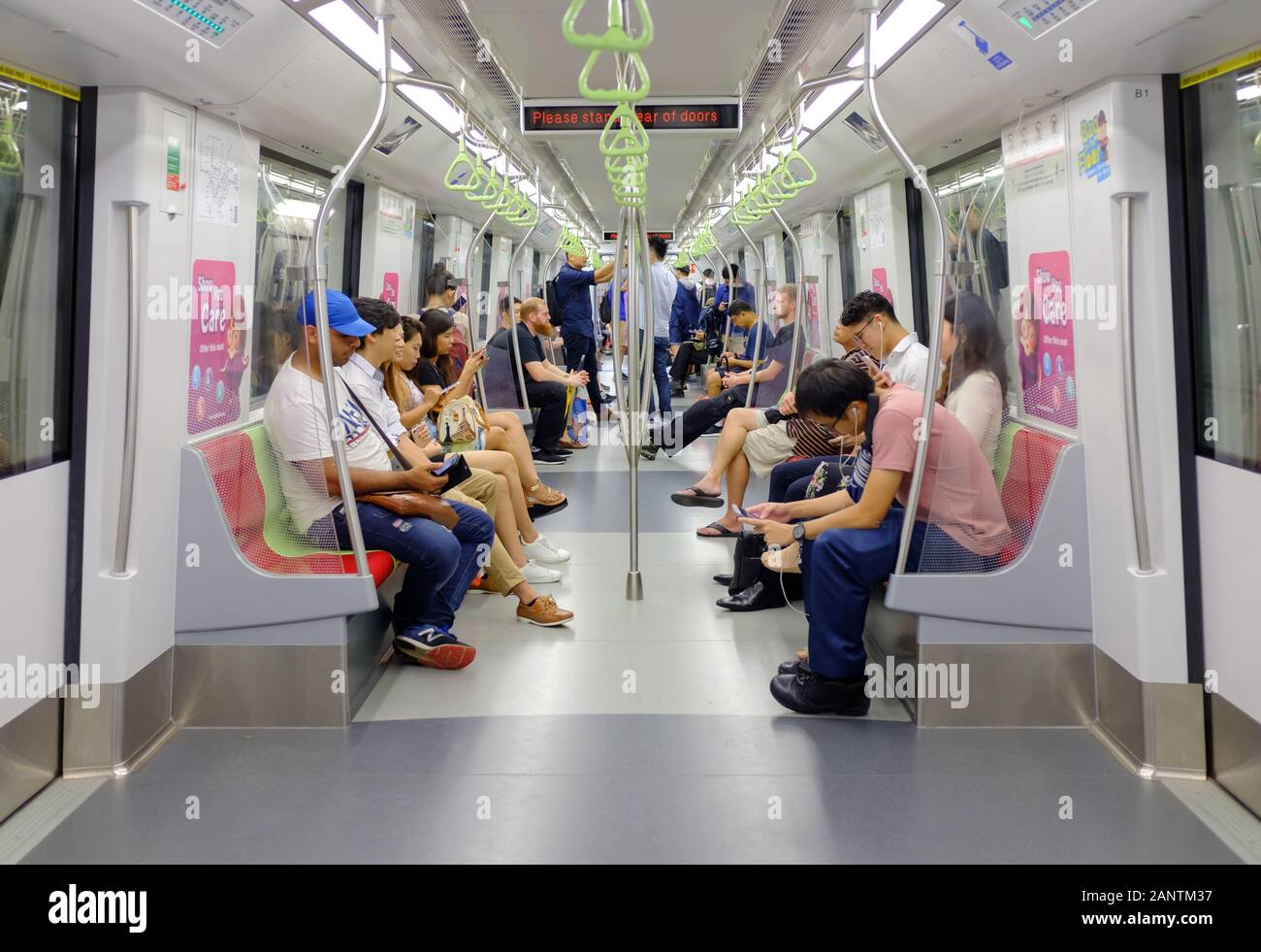 Singapore-13 DEC 2017:Passengers in a crowded Mass Rapid Transit (MRT ...