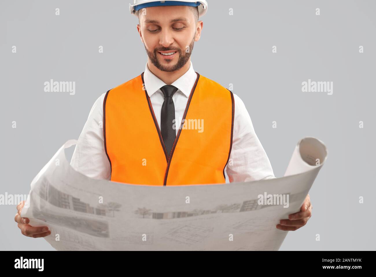 Engineer holding helmet map in hi-res stock photography and images - Alamy