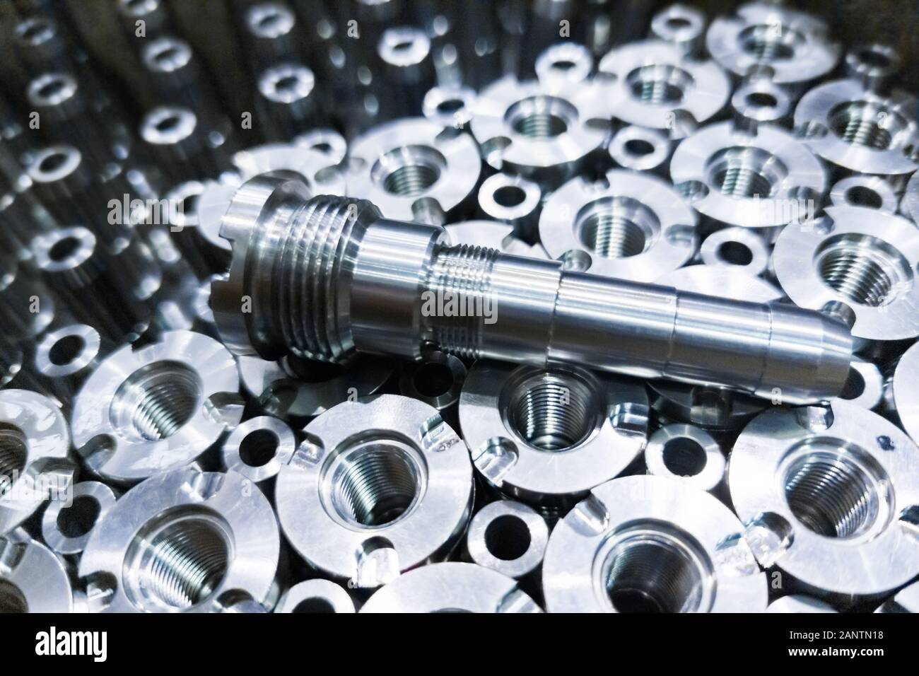 Shiny steel parts close-up background, long clean steel rods after fine ...