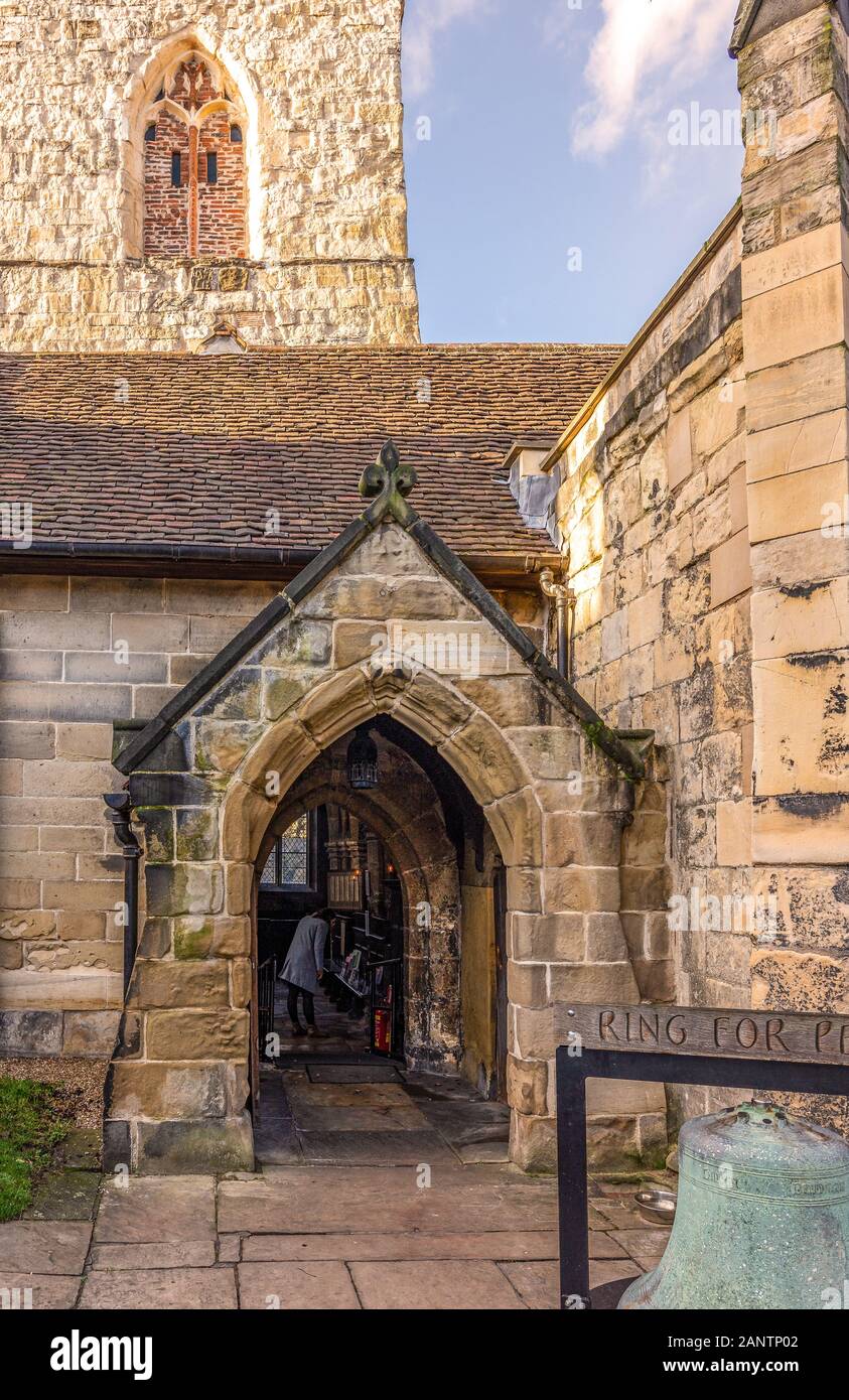Medieval church with its tower in the winter sun and shadows fall ...