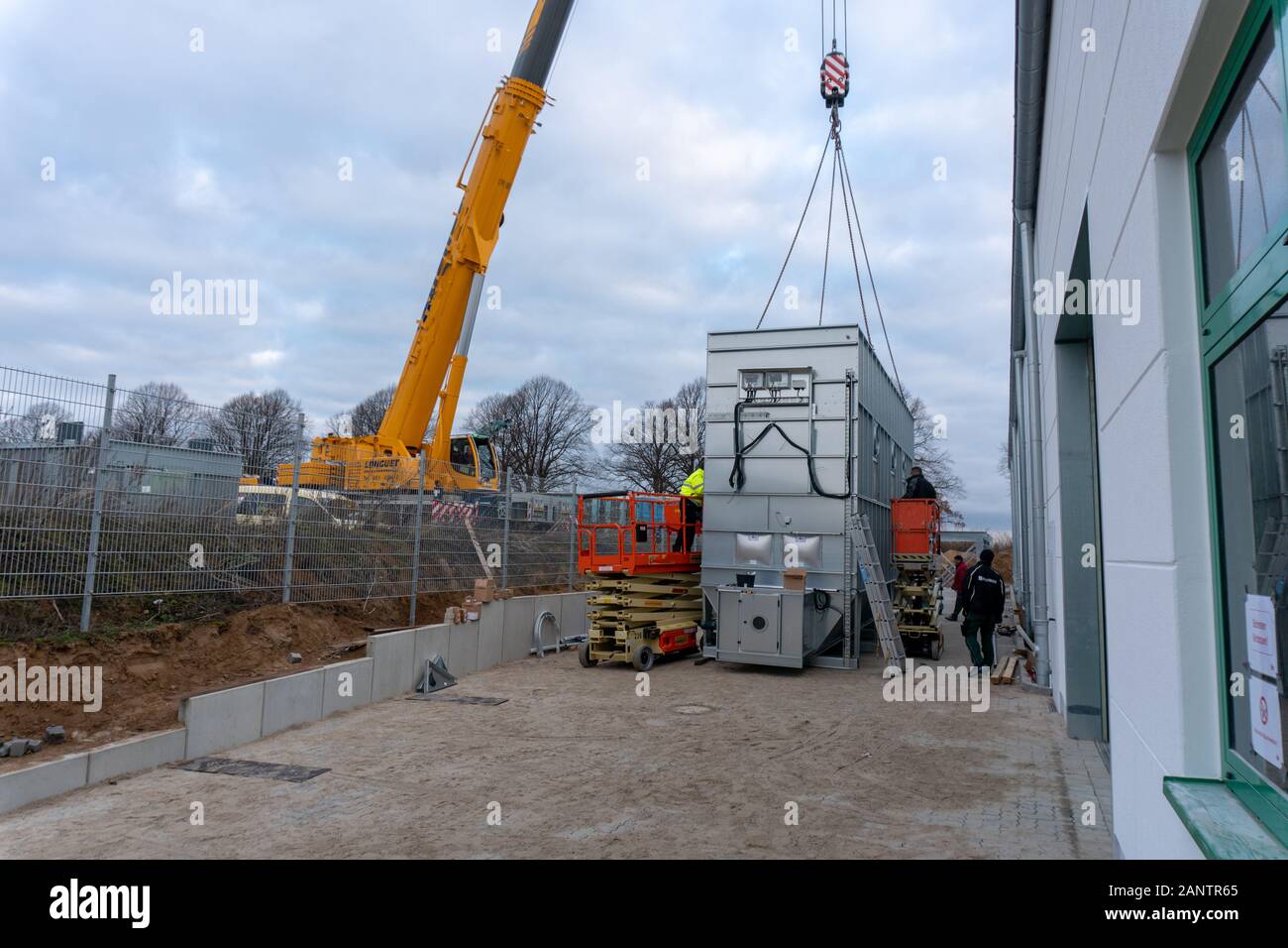 a huge extraction system for wood chips is installed on a factory ...