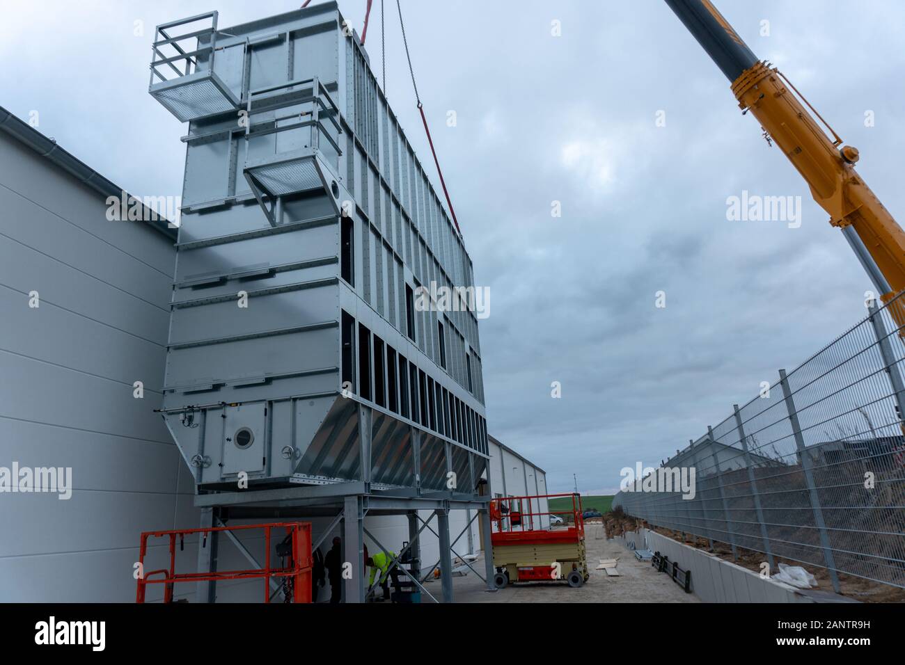a huge extraction system for wood chips is installed on a factory ...