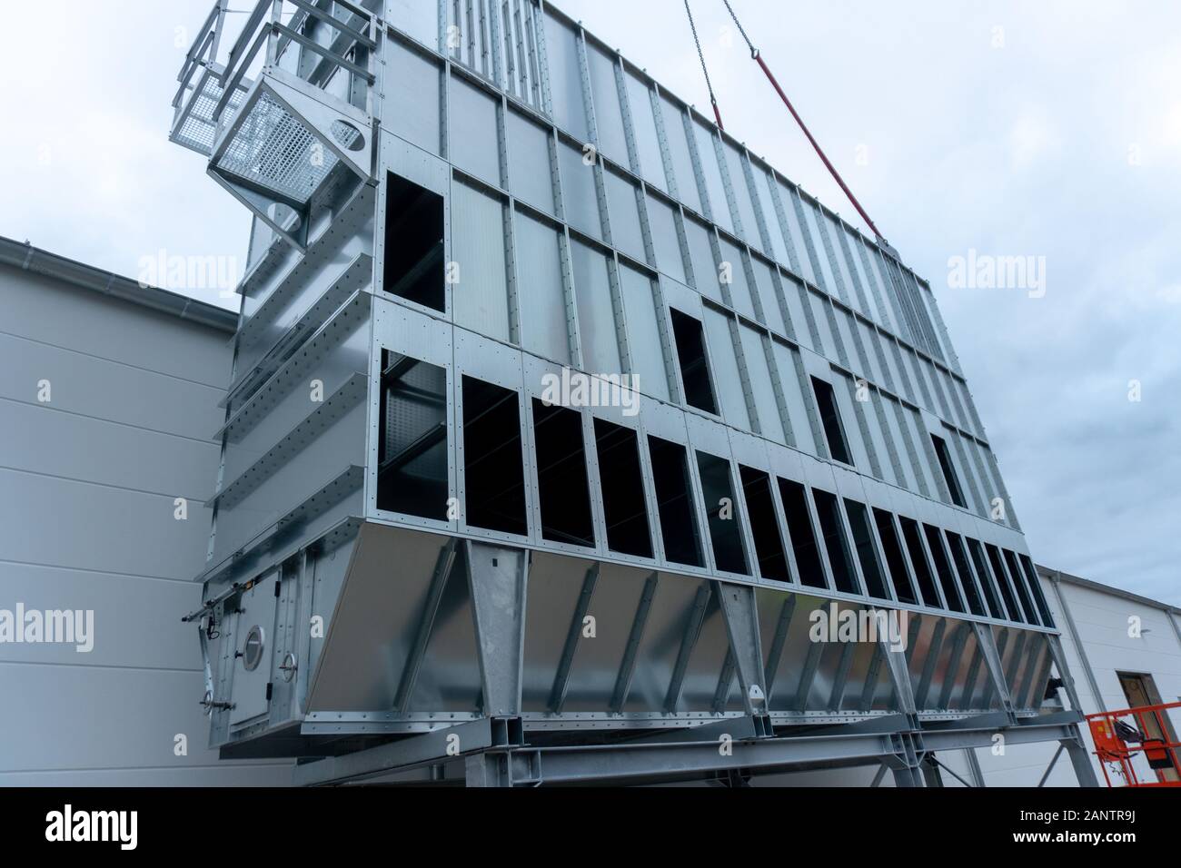a huge extraction system for wood chips is installed on a factory ...