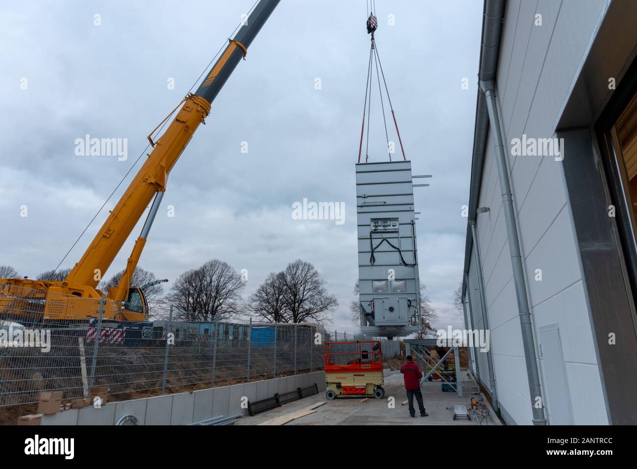 a huge extraction system for wood chips is installed on a factory ...
