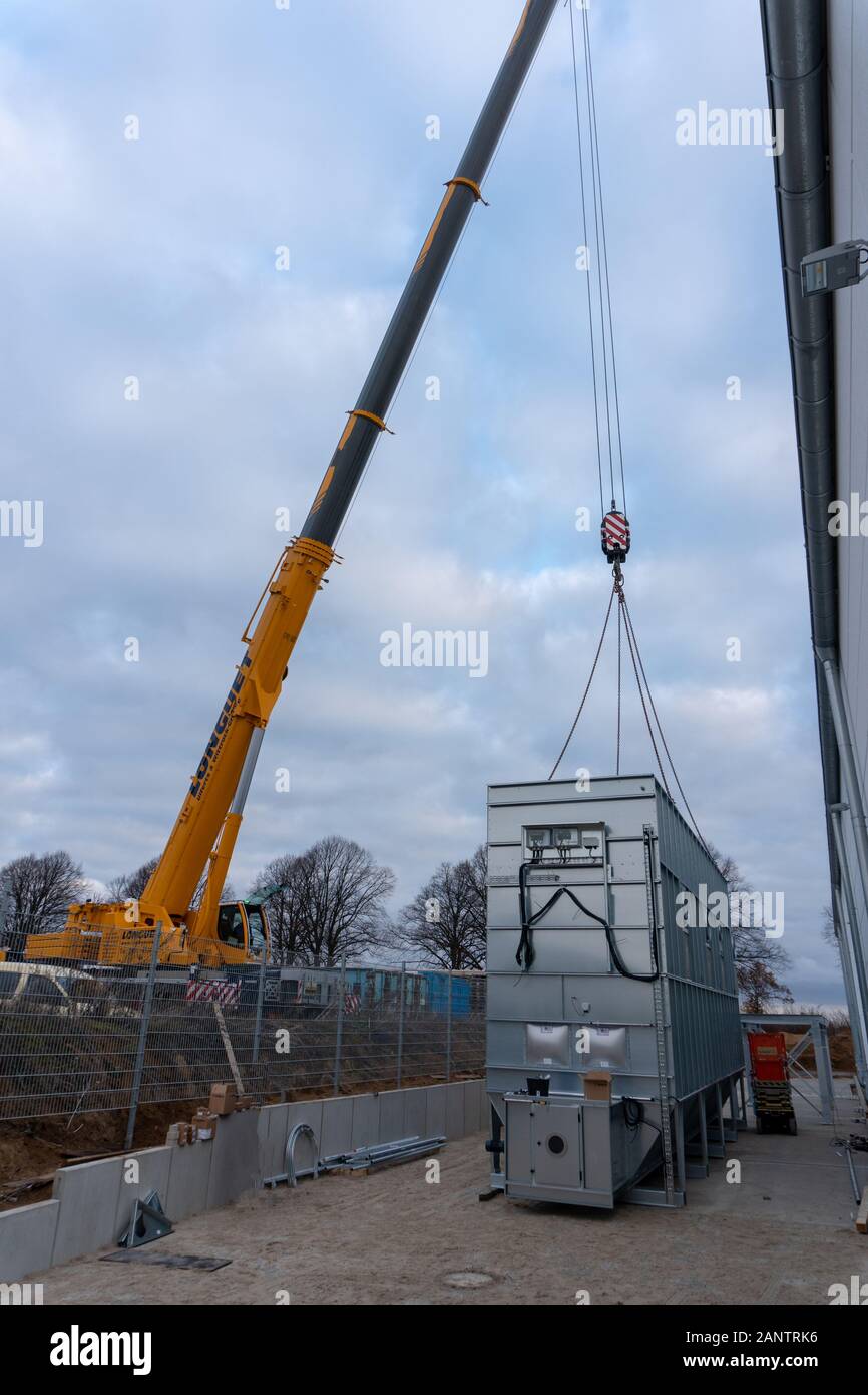 a huge extraction system for wood chips is installed on a factory ...