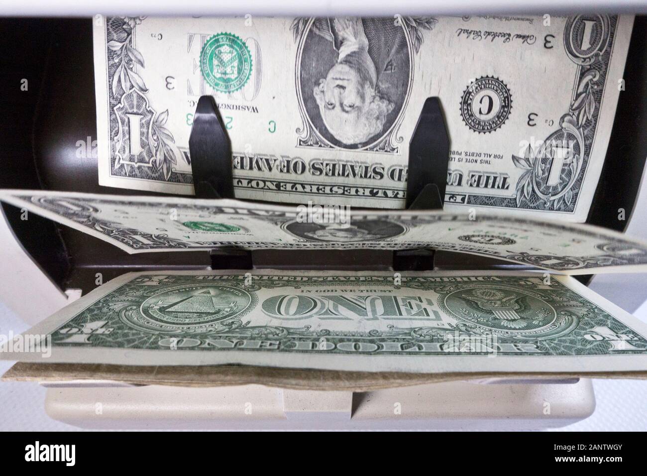 electronic money counter machine is counting the American one dollar(US ...