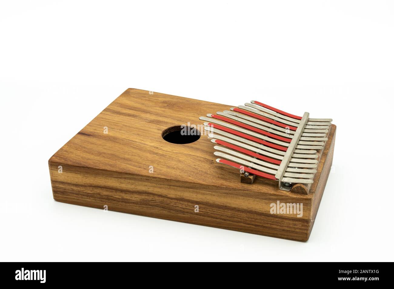 Details of a thumb piano (Kalimba, Mbira) with silver and red tines ...