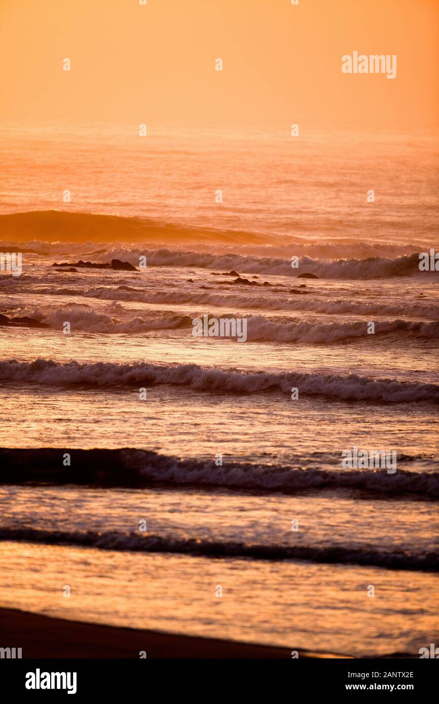 WAVES IN ATLANTIC OCEAN AT SUNSET, CAPE CROSS IN NAMIBIA Stock Photo ...