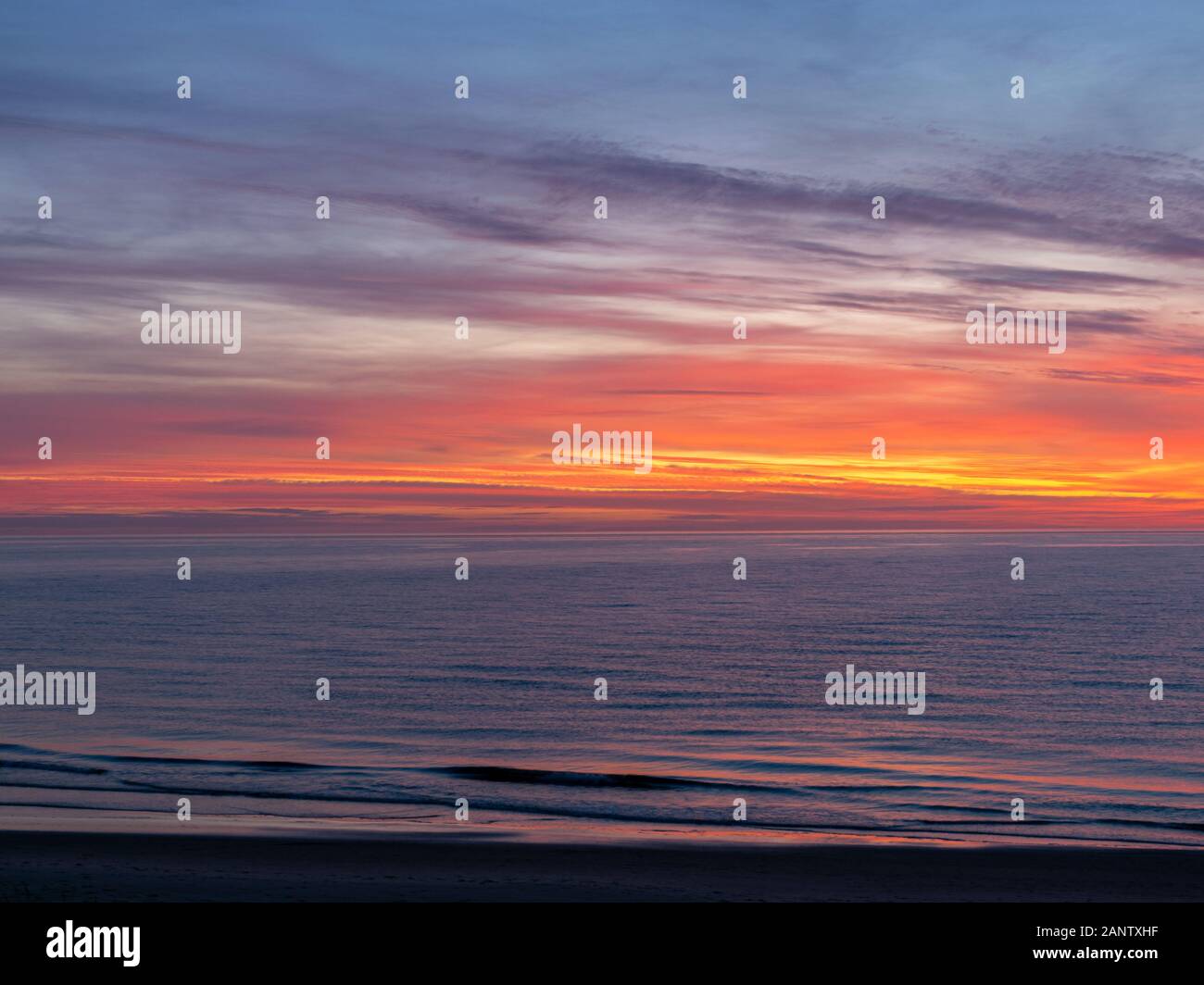 sea sunset landscape with colorful skies and dark water Stock Photo - Alamy
