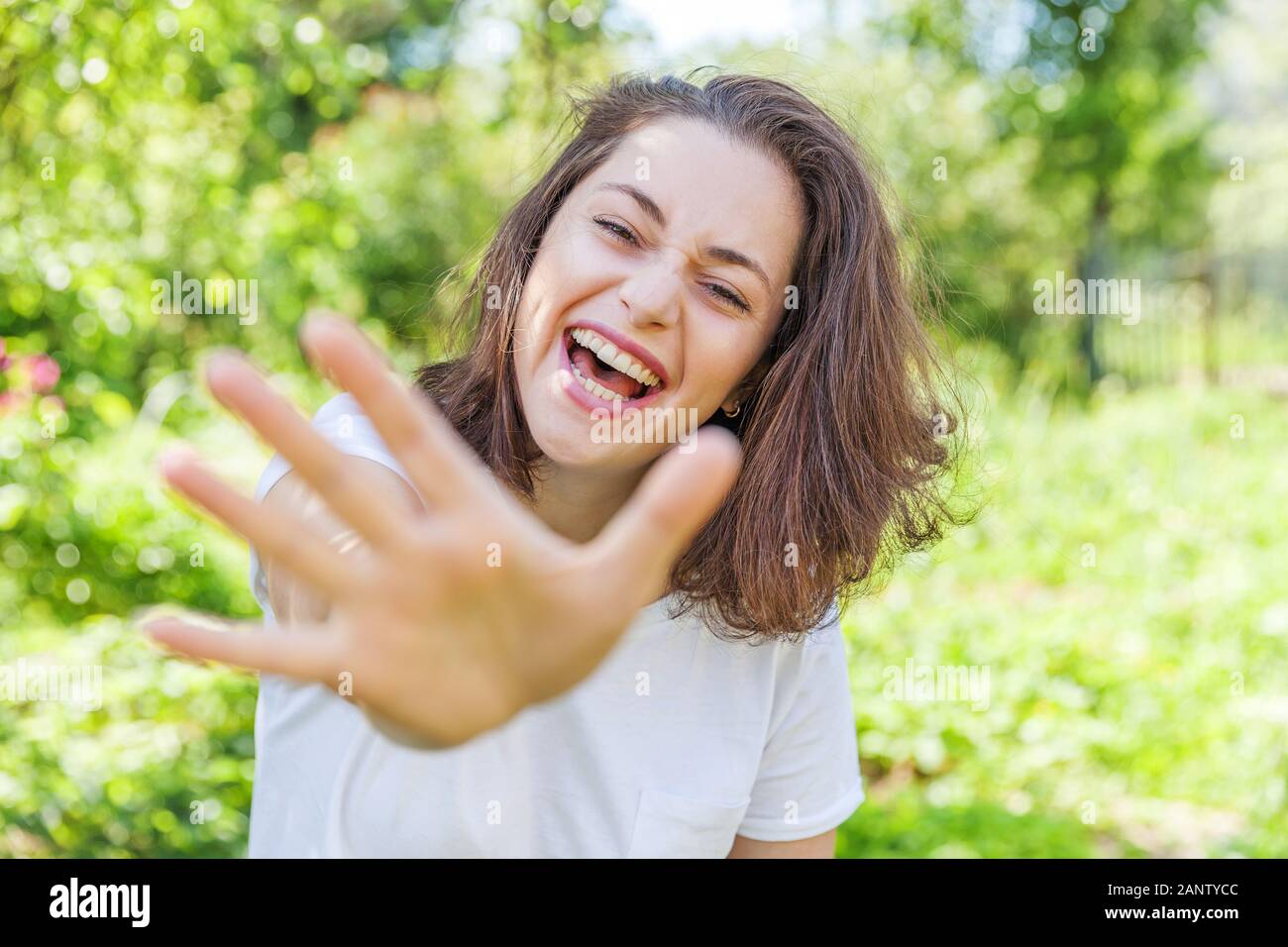 Happy girl smiling outdoor. Beautiful young brunete woman with brown ...