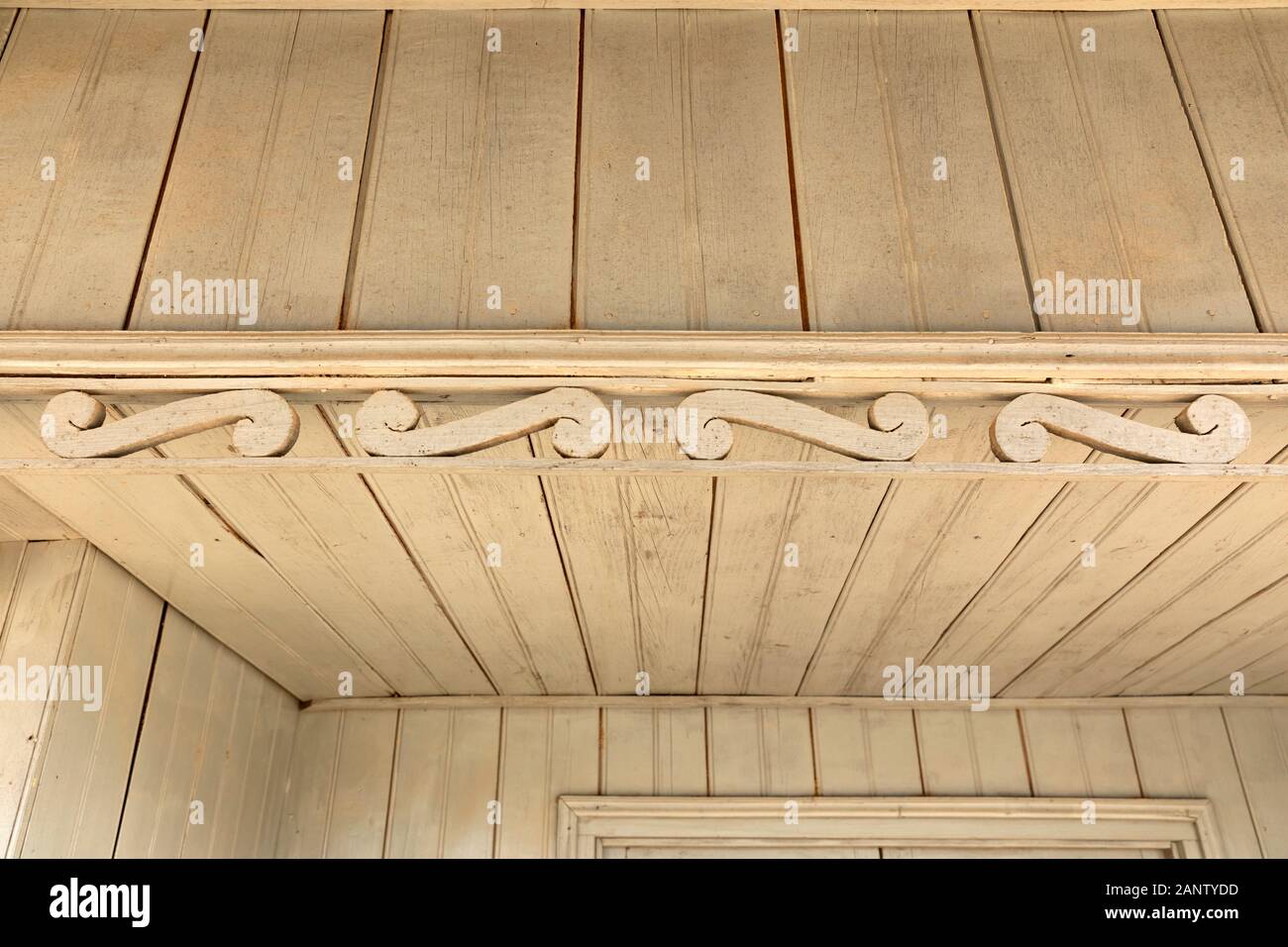 French Colonial scroll architectural details on a small wooden ...