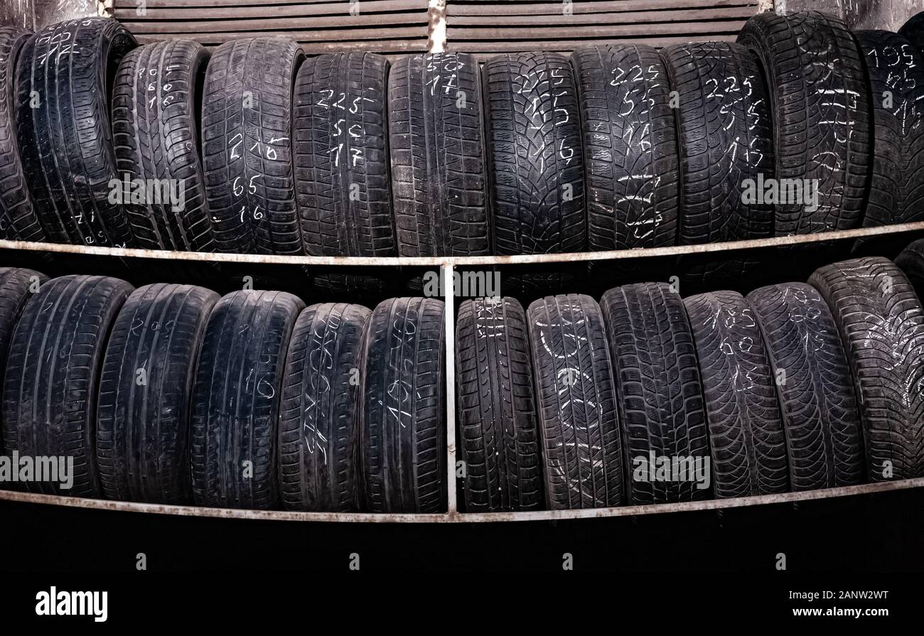 A lot of used out car tires in tire fitting. Stock photo many tires ...