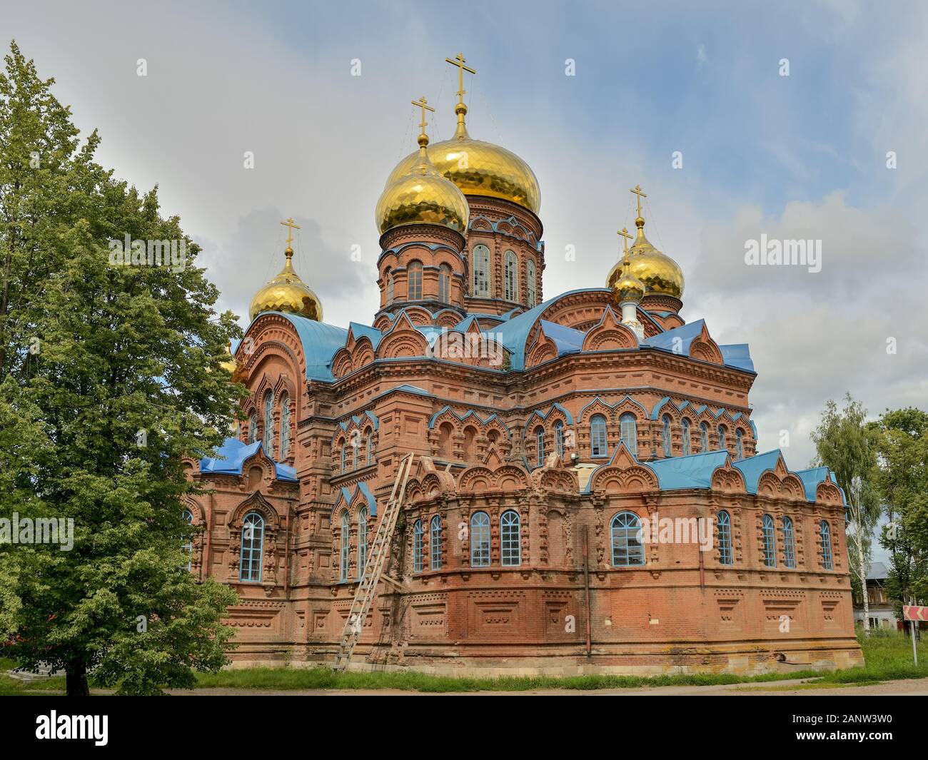 Ancient orthodox church of red brick with golden domes Stock Photo - Alamy