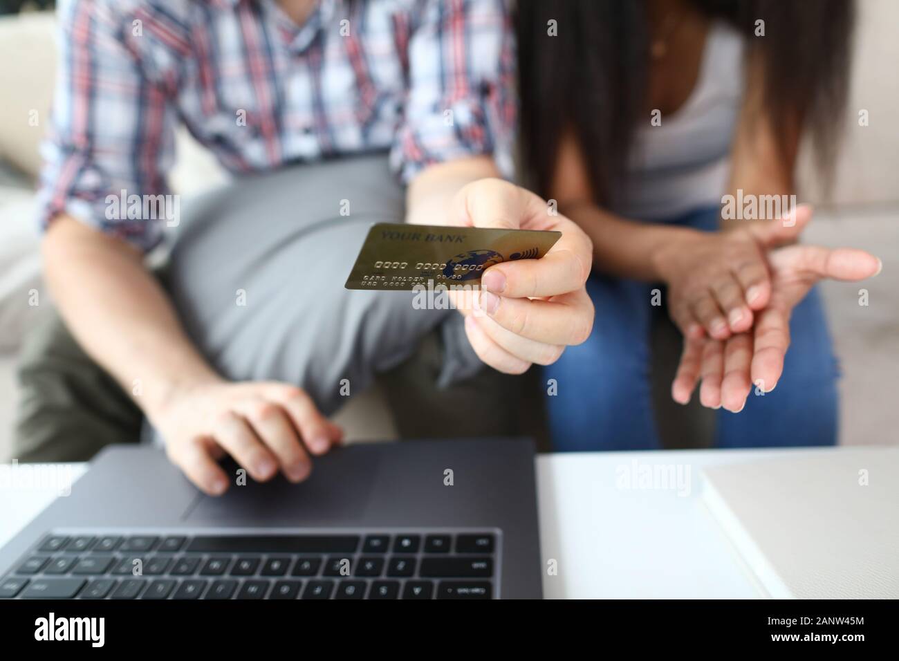 Man and woman learning how to pay via pc Stock Photo - Alamy