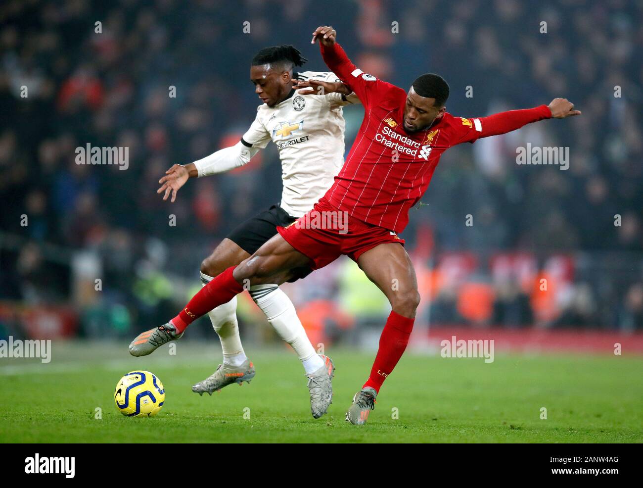 Manchester United's Aaron Wan-Bissaka (left) and Liverpool's Georginio ...