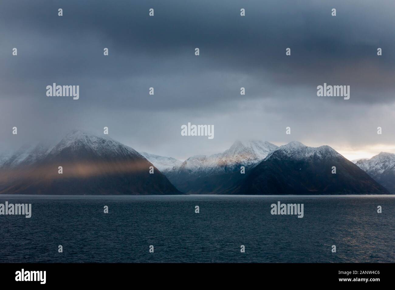 A single shaft of sunlight across the island of Seiland, Hammerfest ...