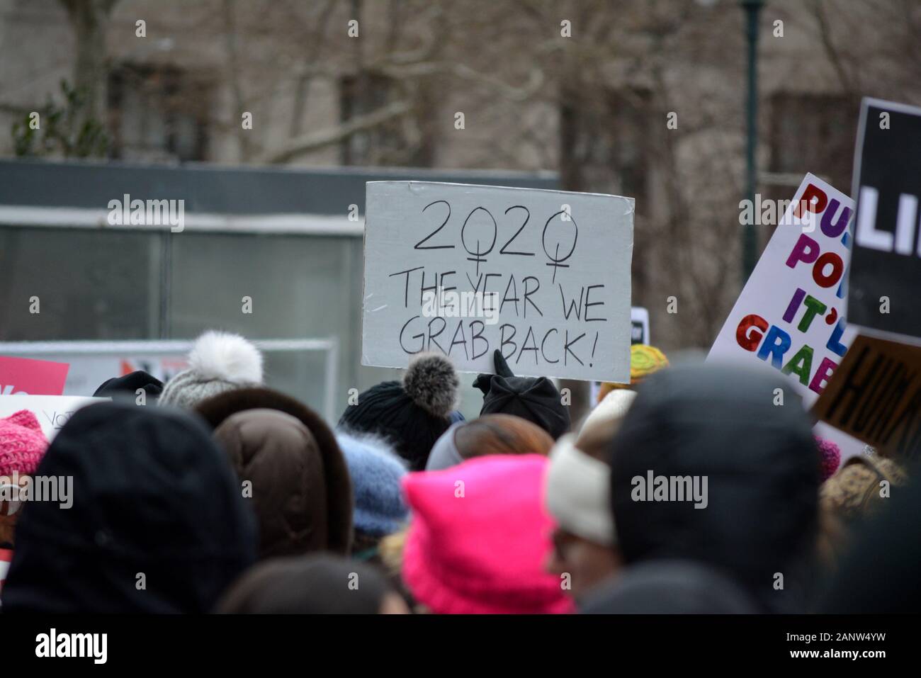 People holding signs at the "Rise and Roar" Women's March from Lower ...