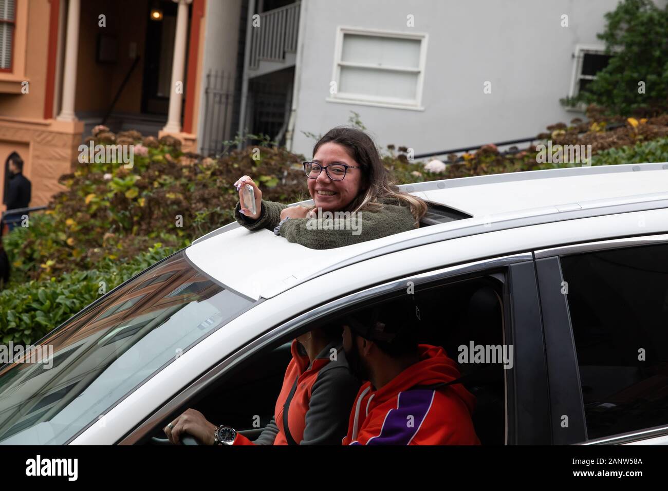 Cars drive slowly down Lombard Street, known as the crookedest street ...