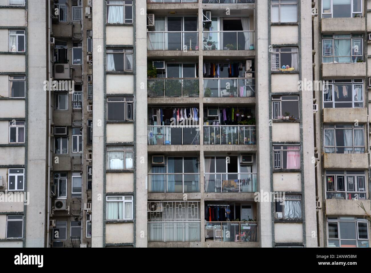 Laundry hangs on the balconies of the crowded apartment buildings in ...