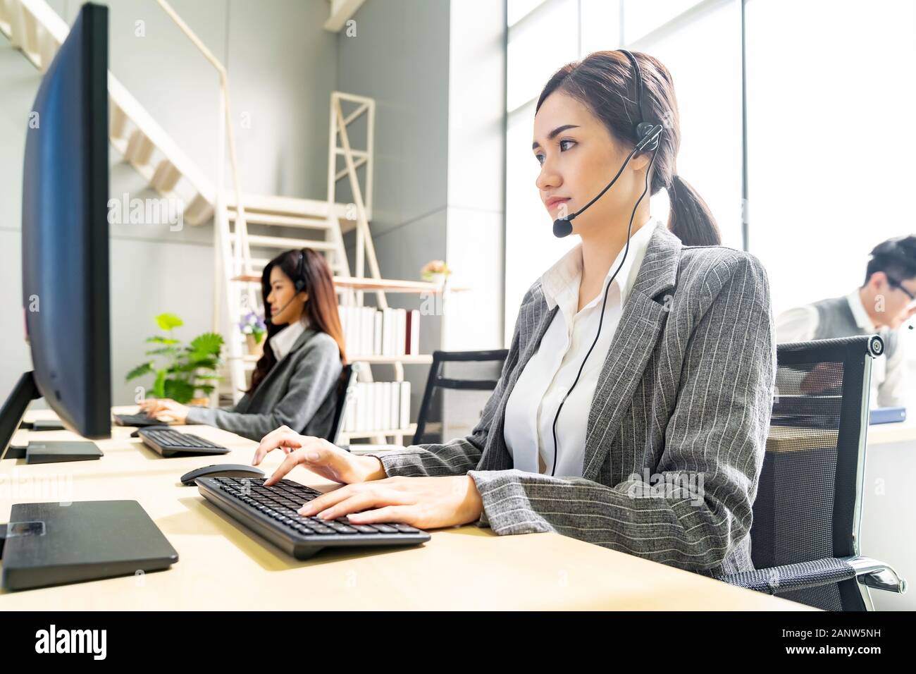 Young adult friendly and confidence operator woman agent smiling with ...