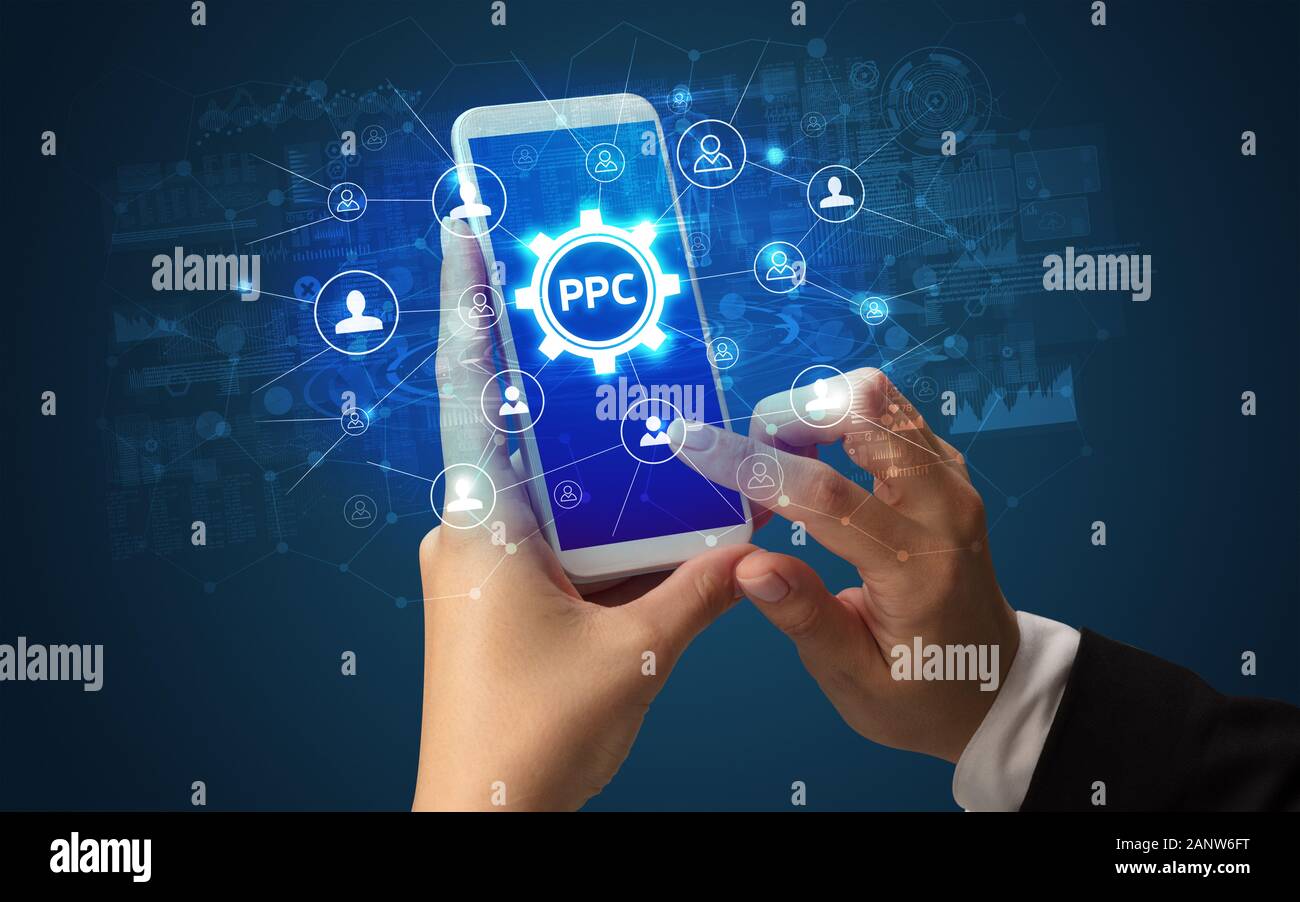 Female hand holding smartphone with PPC abbreviation, modern technology ...