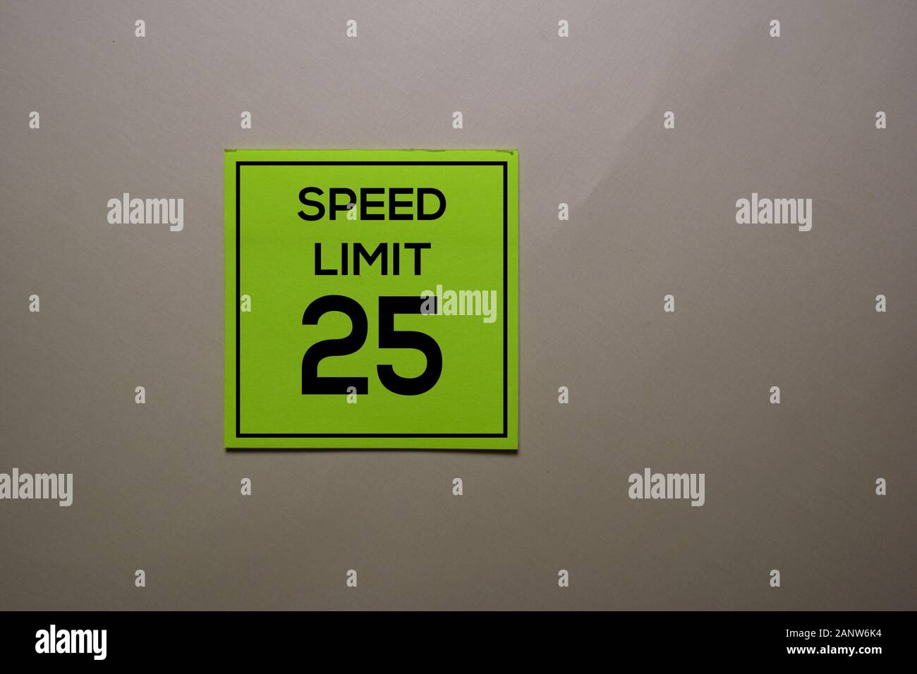 Speed Limit 25 write on a sticky note isolated on office desk Stock ...