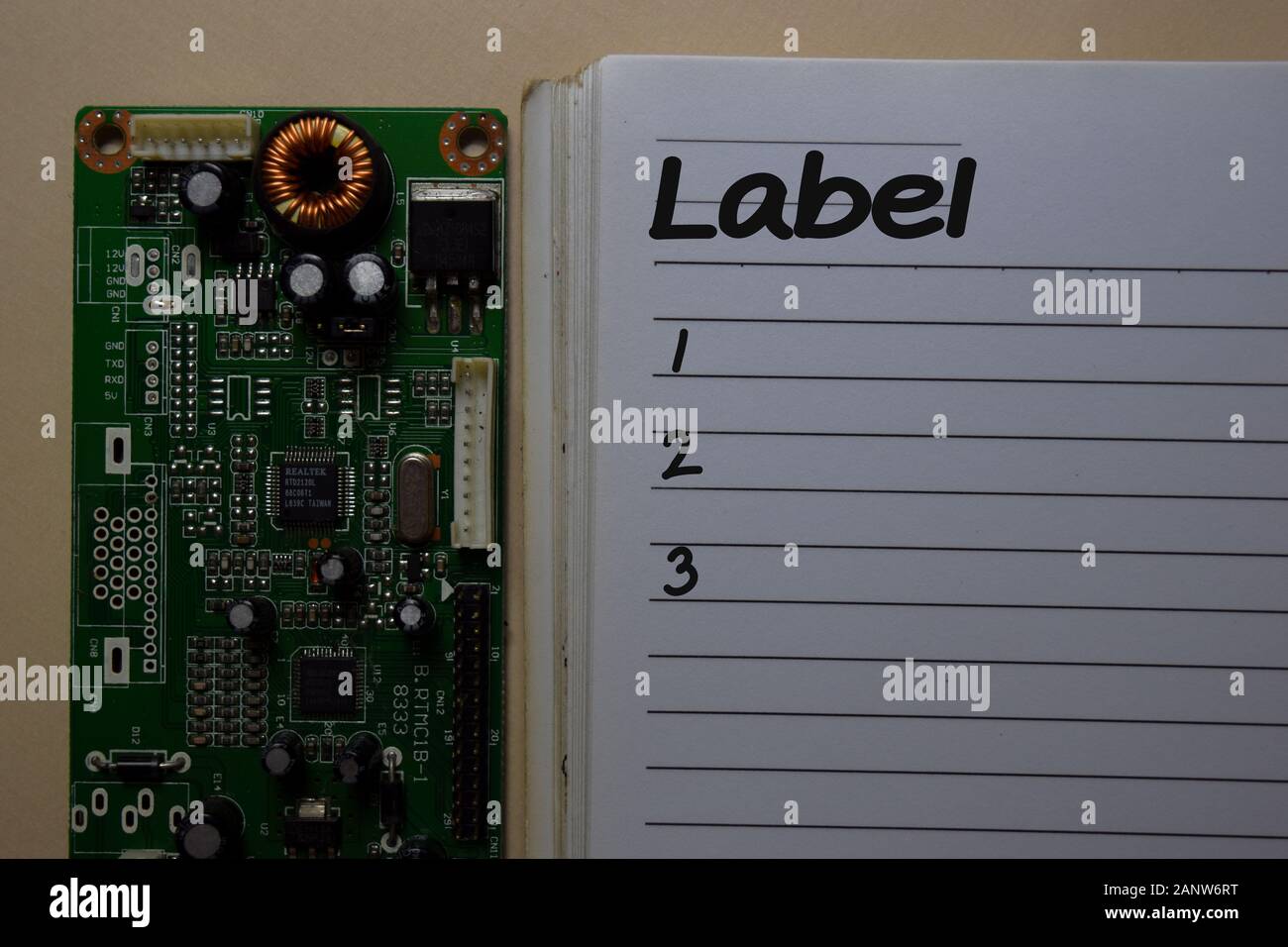 Label with number write on a book with circuit board computer isolated ...