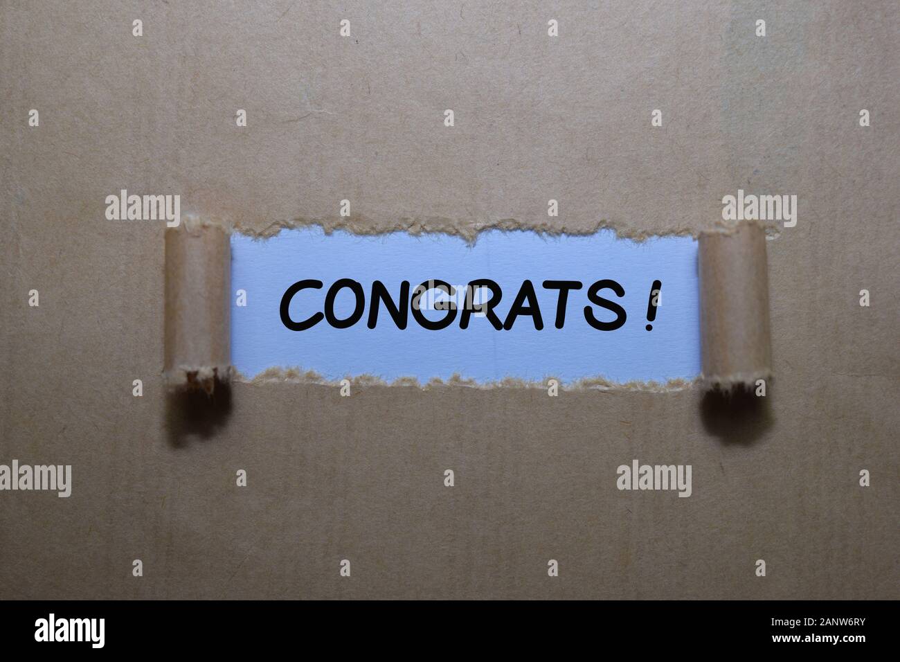 Close up text Congrats! write on brown torn paper Stock Photo - Alamy