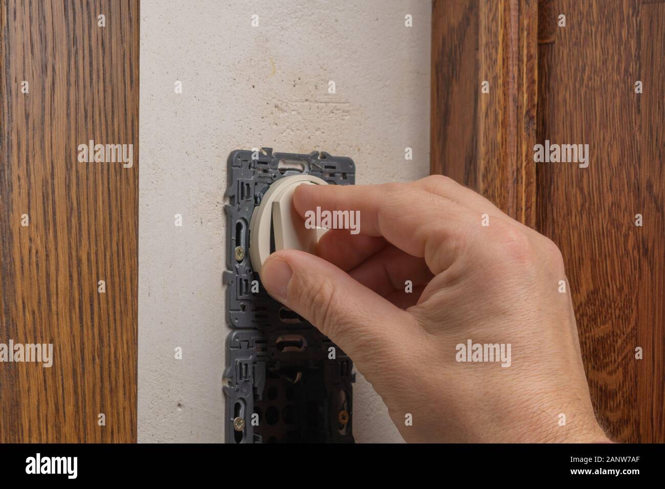 Wall socket . The process of installing an electrical outlet Stock ...