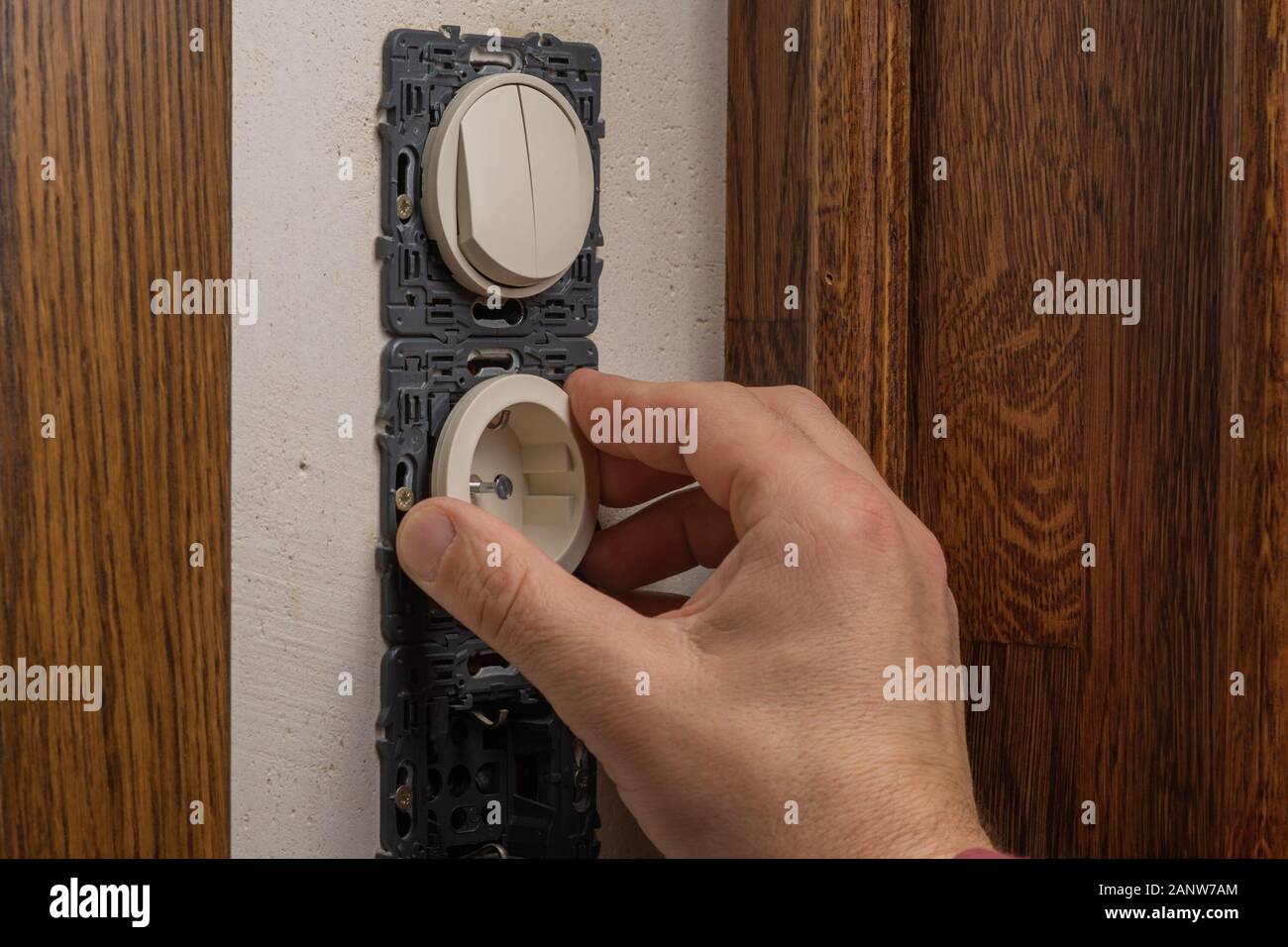 Wall socket . The process of installing an electrical outlet Stock ...