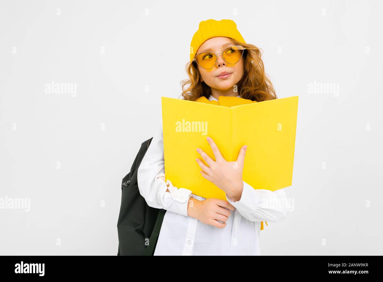 stylish caucasian charming girl in a white shirt, with a hat and a ... stylish caucasian charming girl in a white shirt, with a hat and a ...
