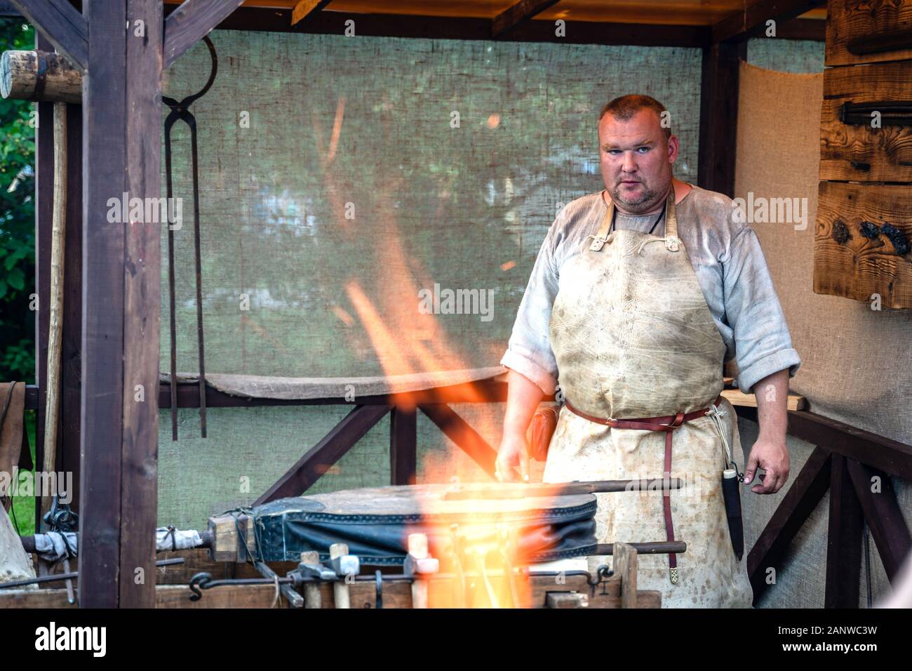 Forge in the open air during the living history festival. Tall and ...